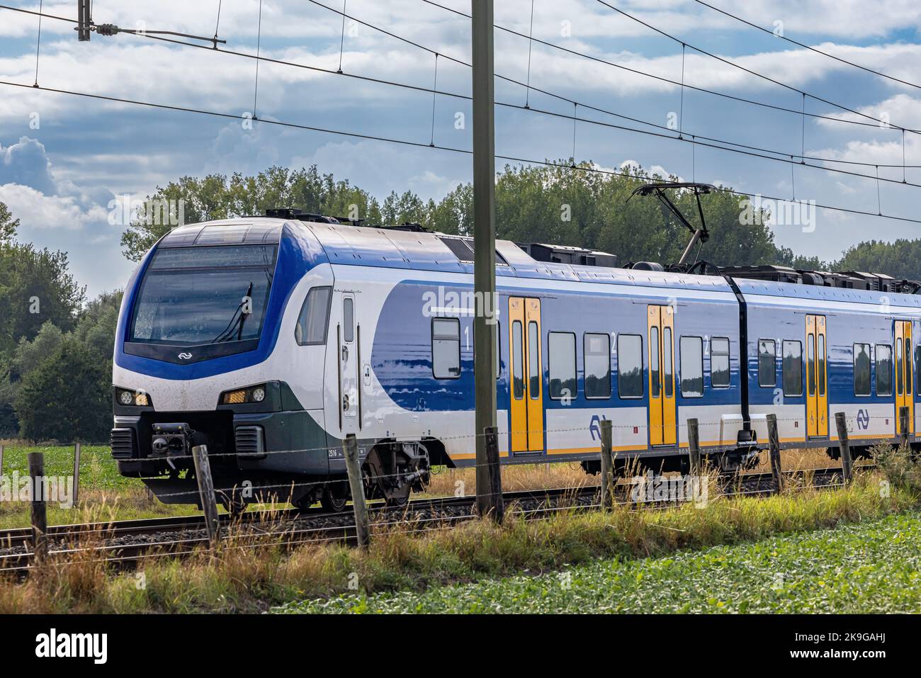 A sunny day while a NS sprinter train riding on a Dutch railway Stock ...