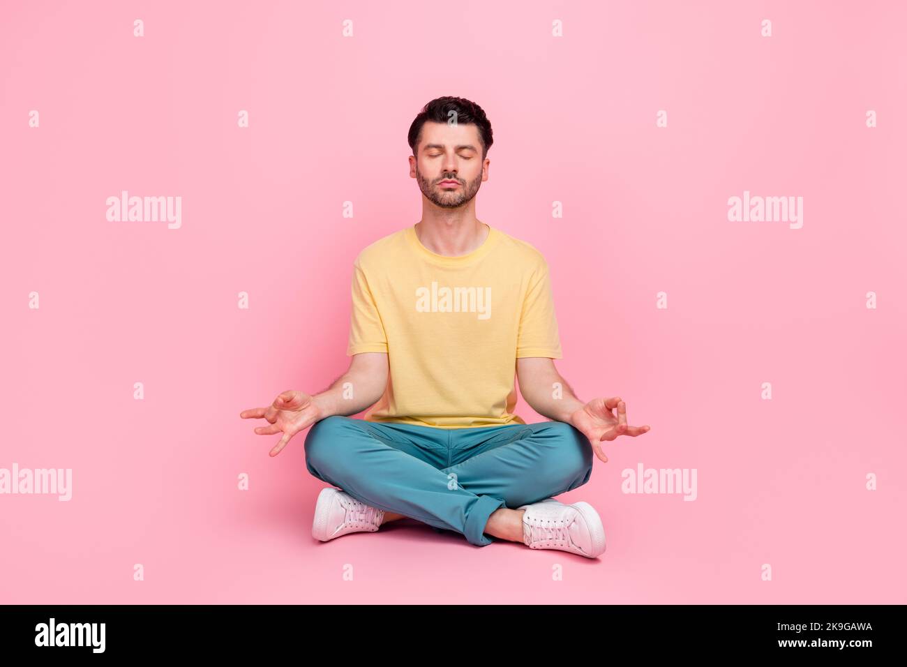 Full length photo of calm nice man sitting floor yoga physical lesson ...
