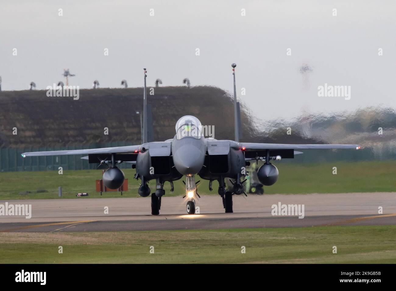 F-15E Strike Eagle taxiing for takeoff at sunrise, RAF Lakenheath ...