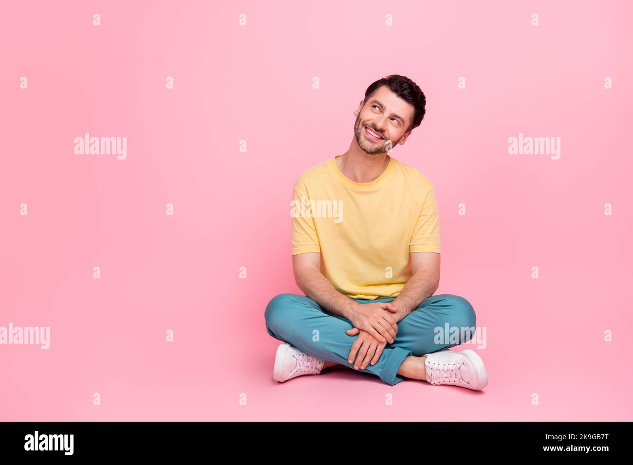 Photo of optimistic man dressed yellow trendy clothes interested look ...