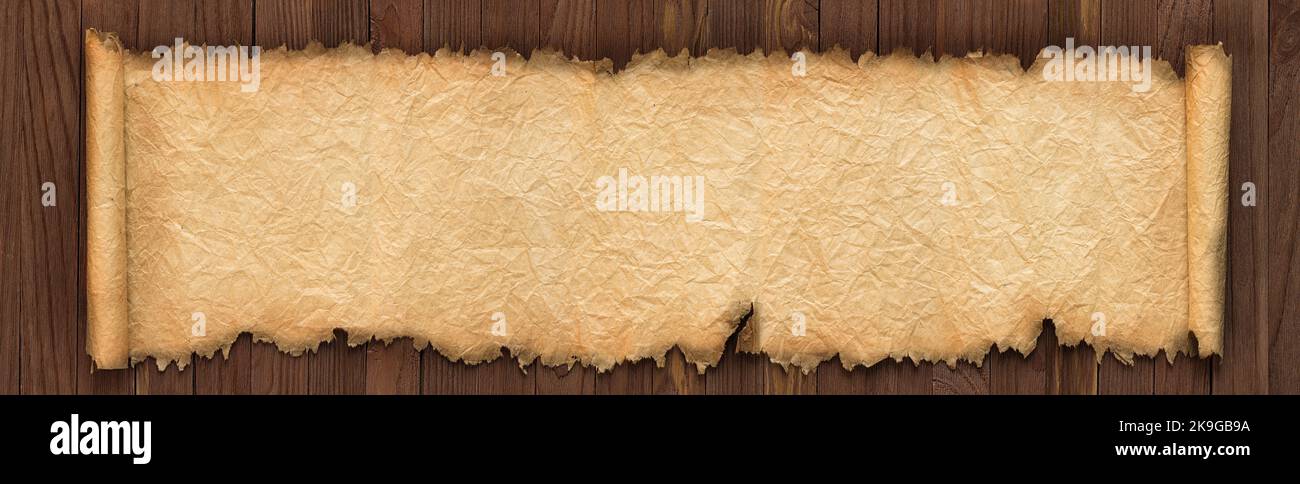 Old scroll on a wooden table, crumpled paper texture as background ...