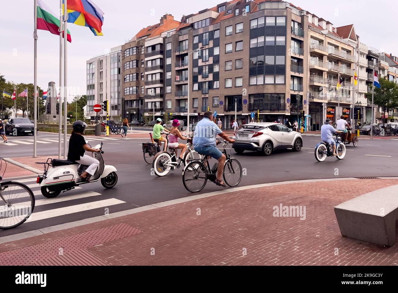 A group of people riding their bikes on the road Stock Photo - Alamy