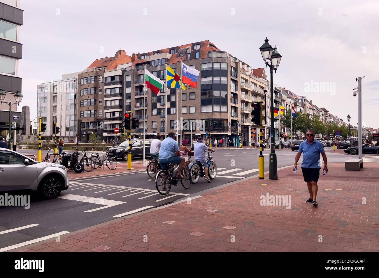 A group of people riding their bikes on the road Stock Photo - Alamy