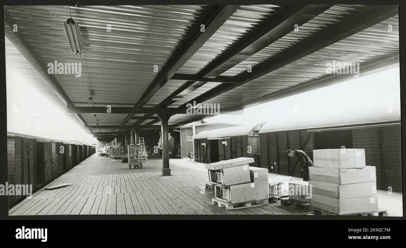 Freight wagons and goods on roofed cargo dock 1963 Stock Photo - Alamy