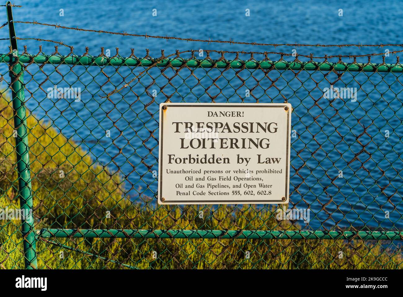 A sign of No Trespassing in a fenced-off area of Bolsa Chica ecological ...