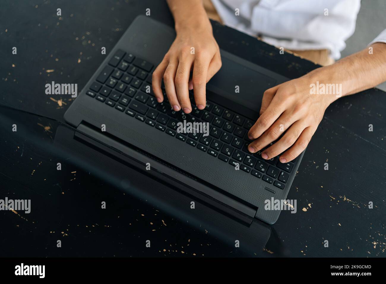 Close Up Top View Of Unrecognizable Young Man Typing Texting On Modern