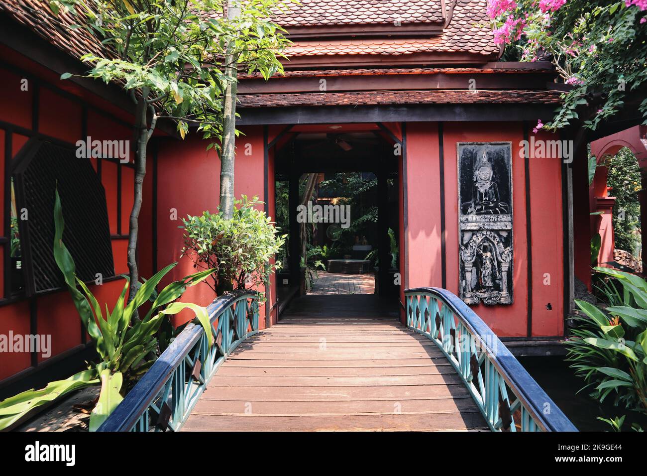 A wooden cross bridge leading to the gateway at The Khmer House, Secret ...