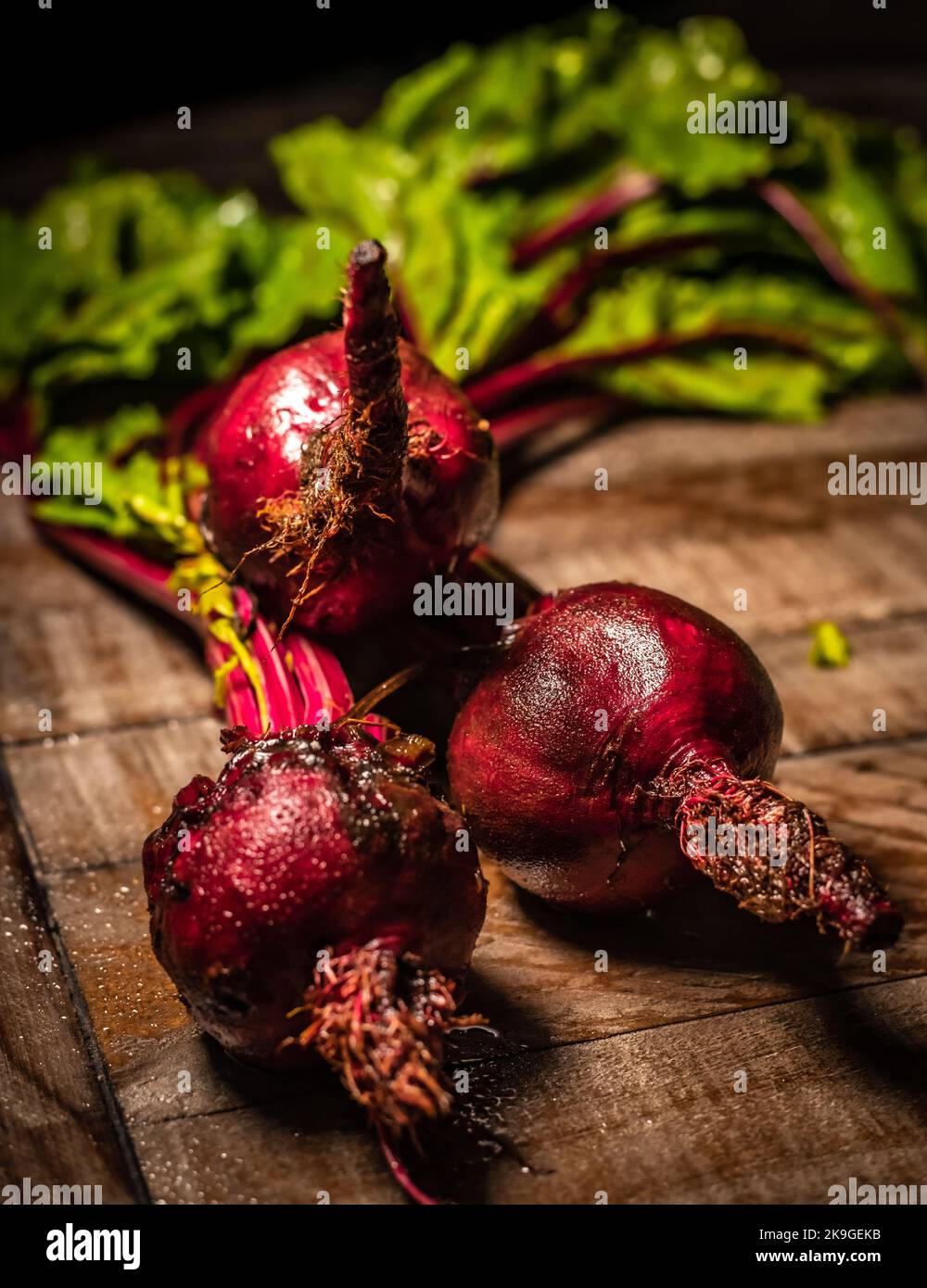 The vertical close-up view of the fresh organic red beetroots over the ...