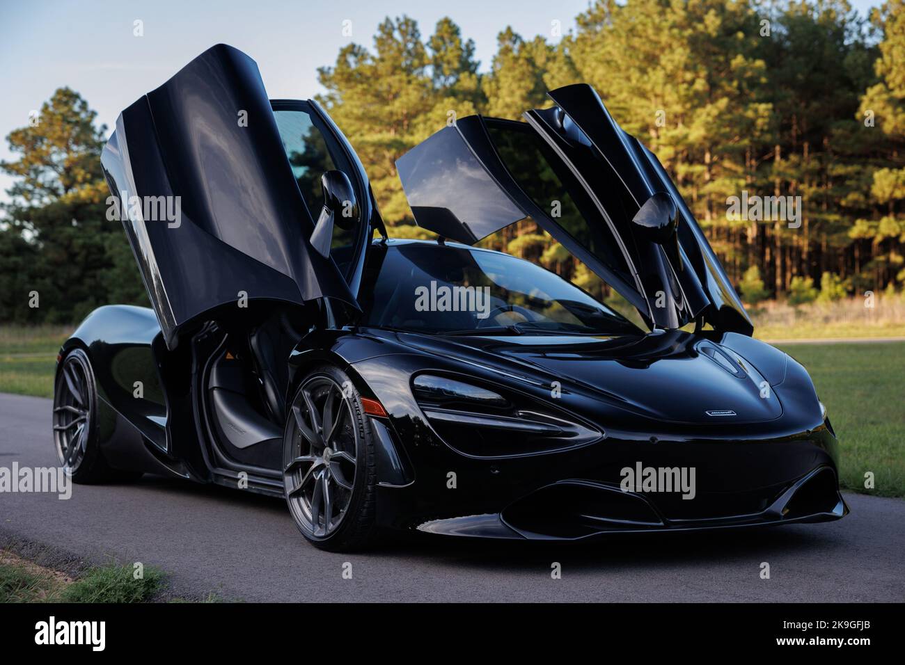 Black McLaren 720s with butterfly doors expanded on a road Stock Photo ...