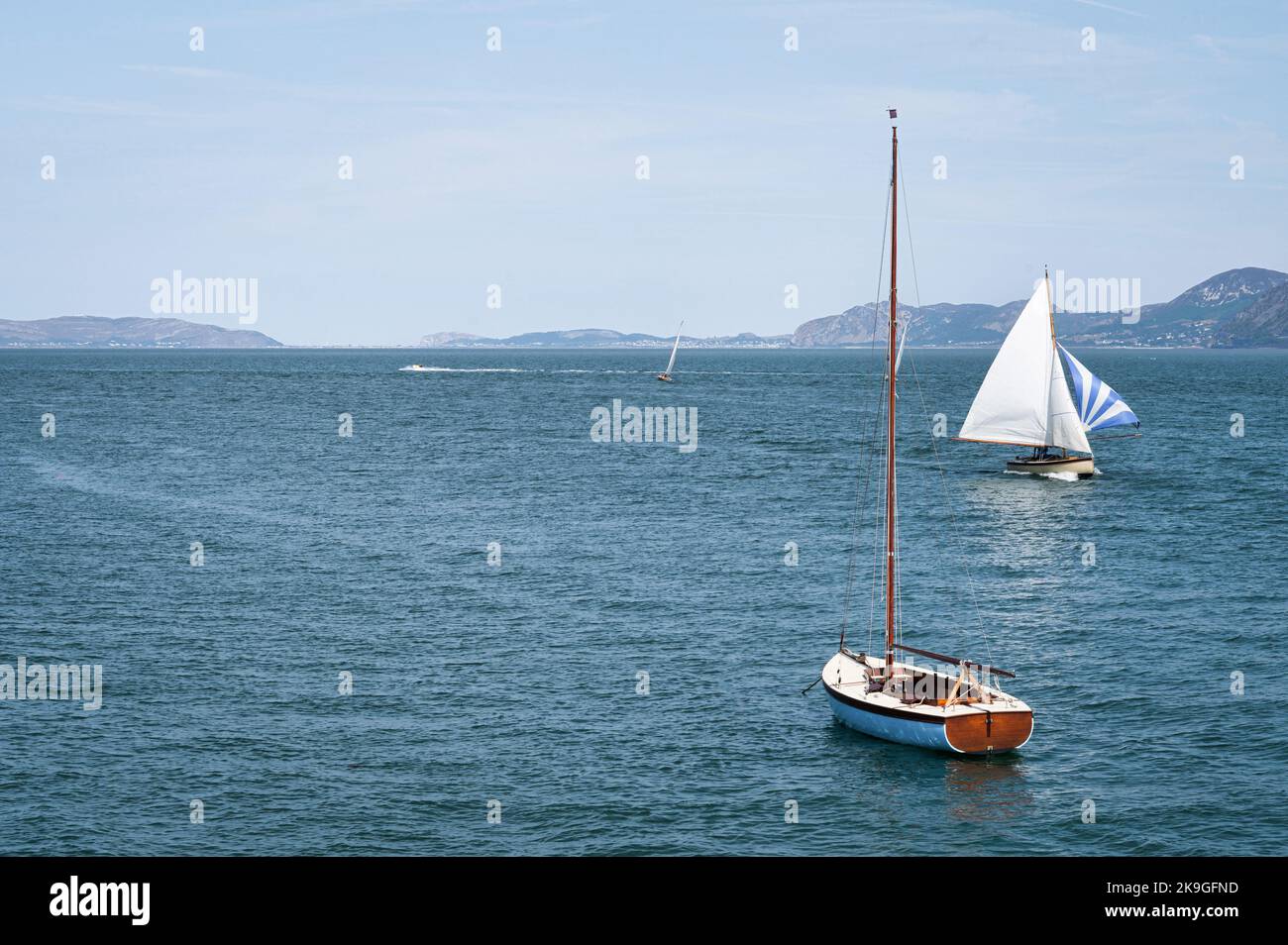 Sailboats out on the water just off the shore of Beaumaris in North ...