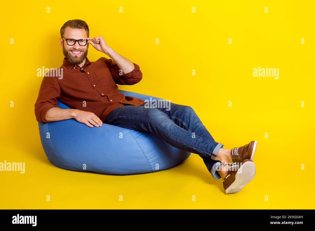 Full length portrait of positive cheerful person sitting bag arm touch ...