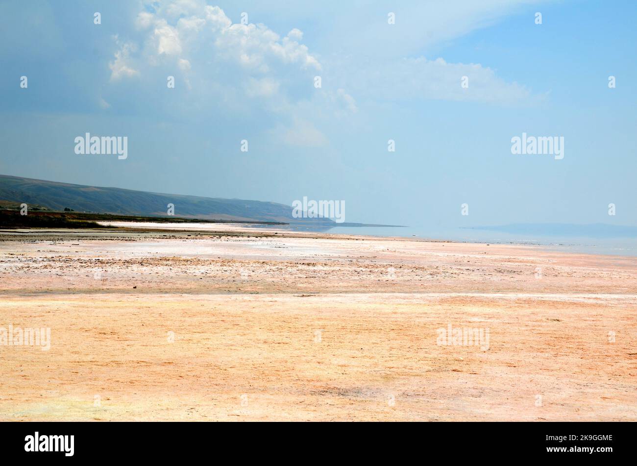 yellow and pink reflection of the shallow water of "Tuz Gölü" salt lake ...