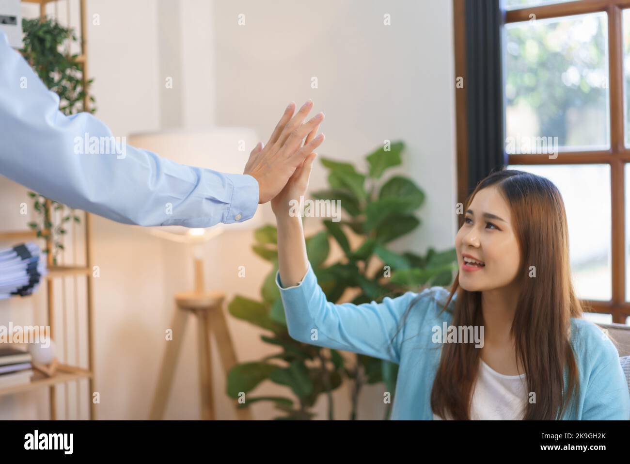 Healthcare concept, Woman caregiver and businessman giving high five ...