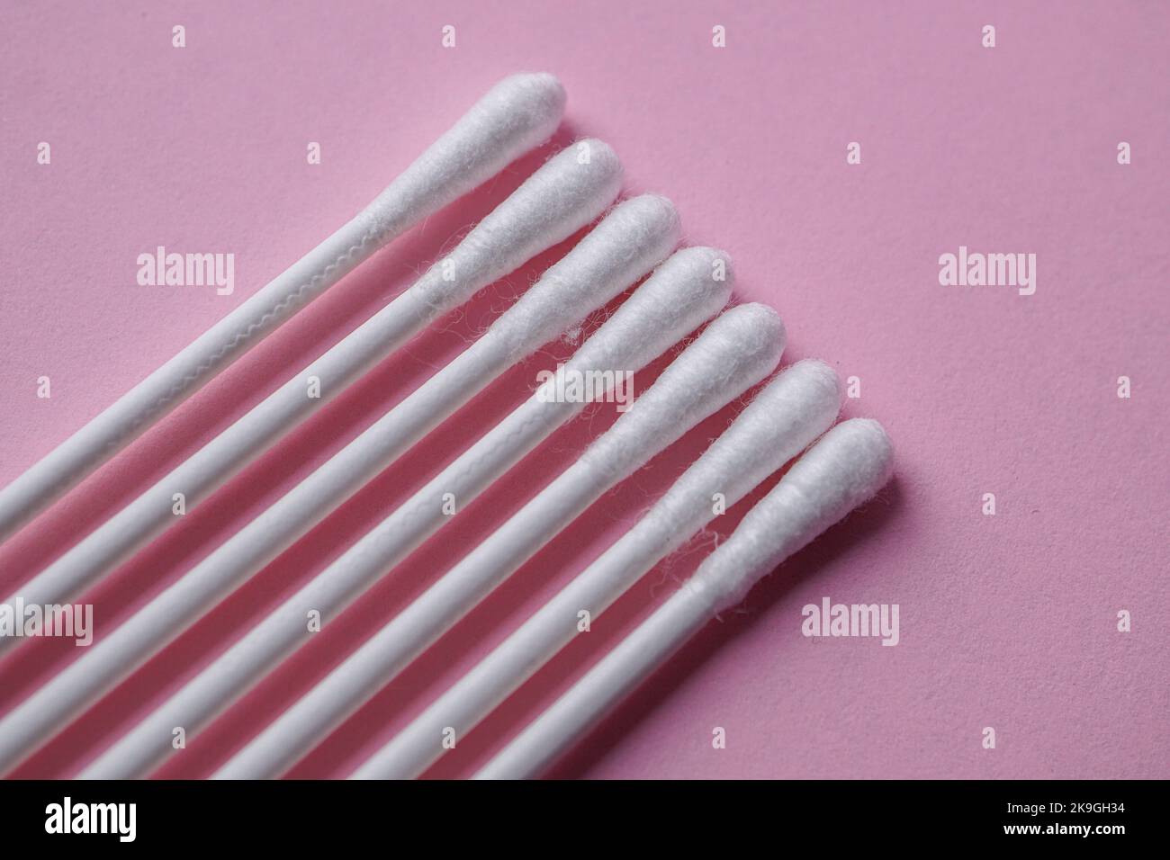 cotton swabs on the pink background, cosmetic and hygienic product ...