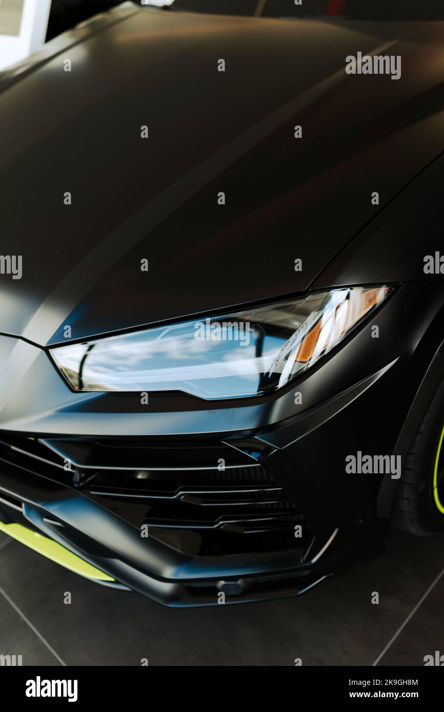 A headlight of luxurious black Lamborghini exotic car Stock Photo - Alamy