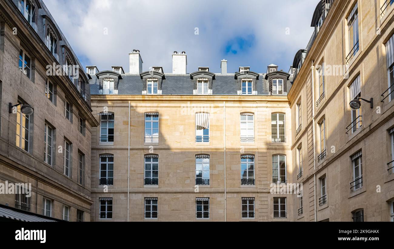 Paris, small square with beautiful buildings in the historic center ...