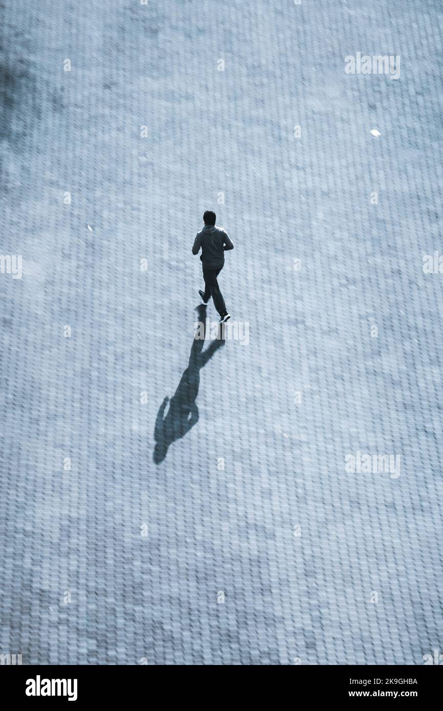 athlete running on the street in Bilbao city, basque country, spain ...