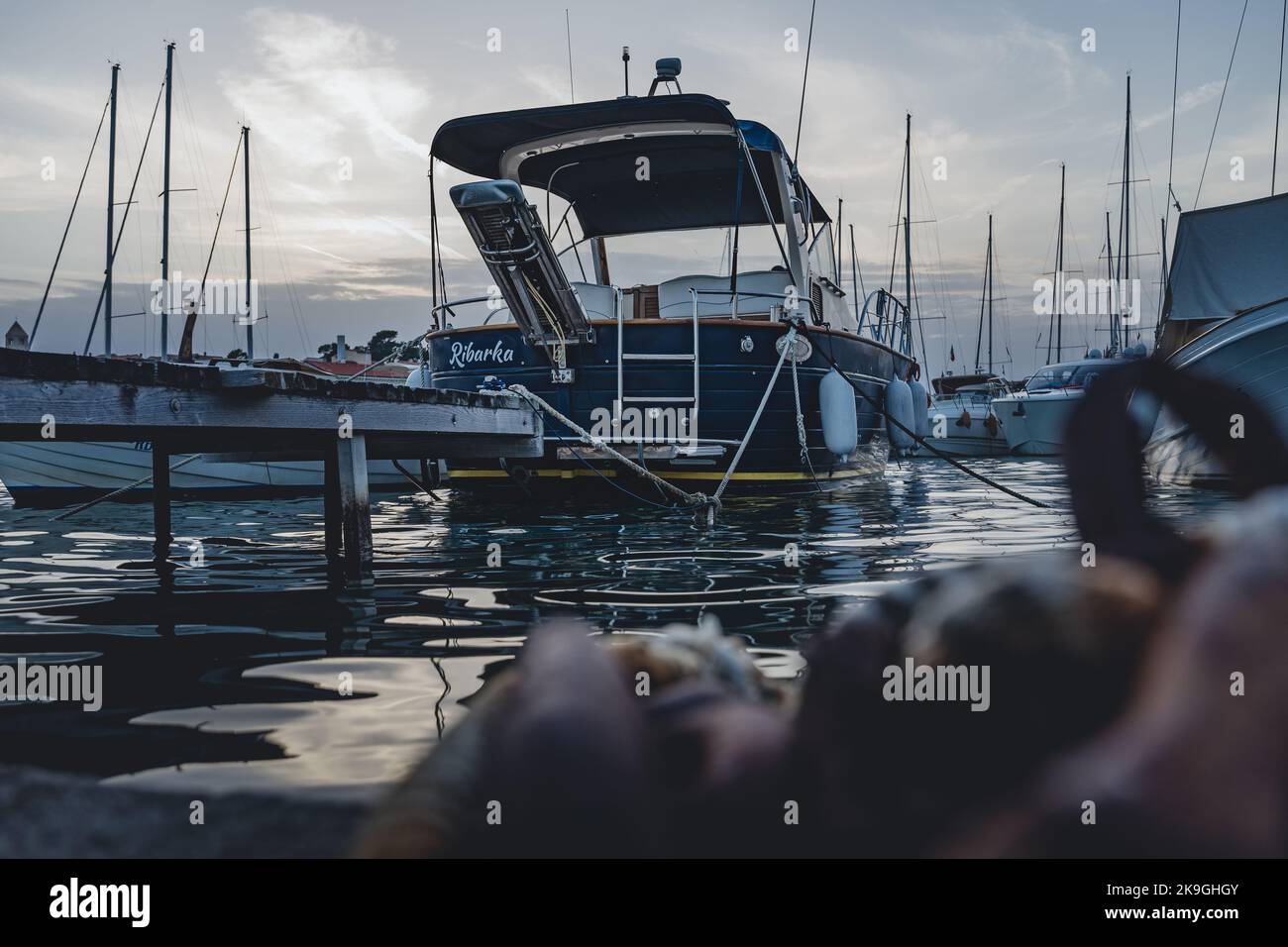 A blue boat harbored at the port of Rab in Croatia Stock Photo - Alamy