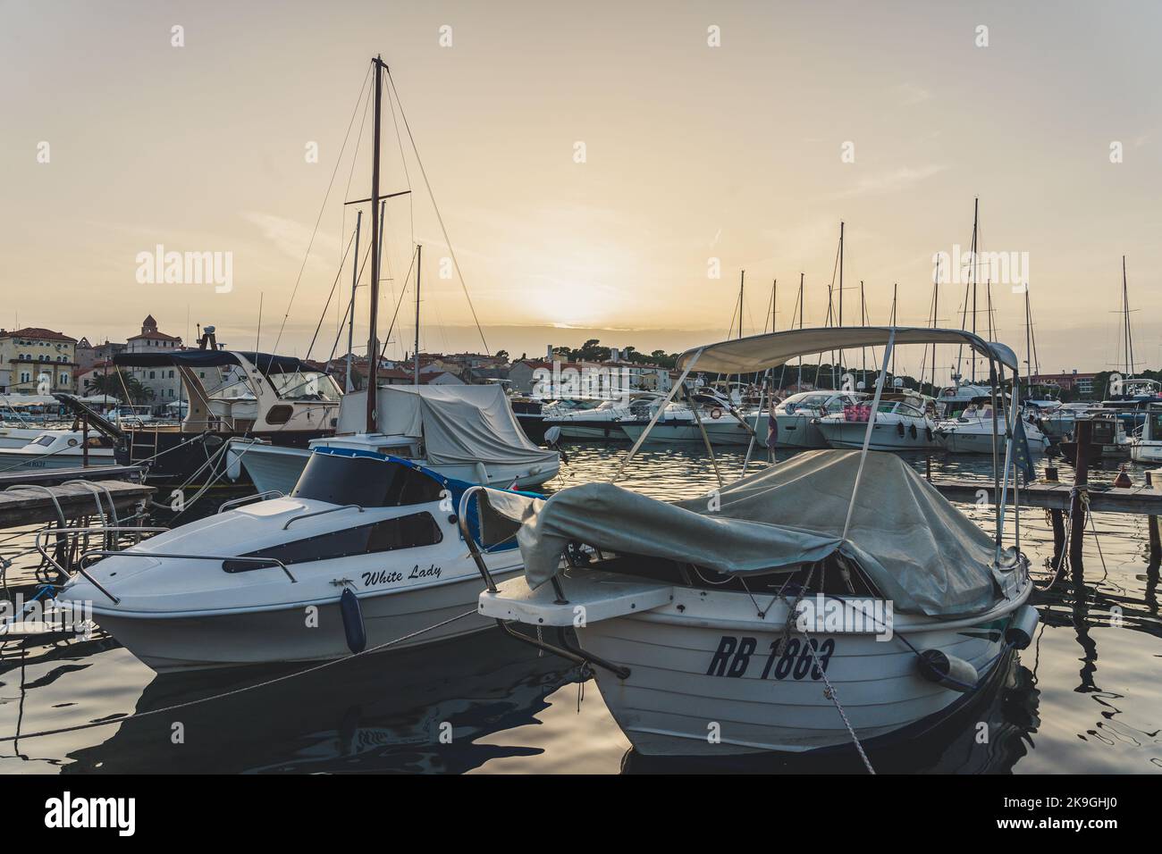 Two white boats harbored in a dock on the island of Rab, Croatia Stock ...