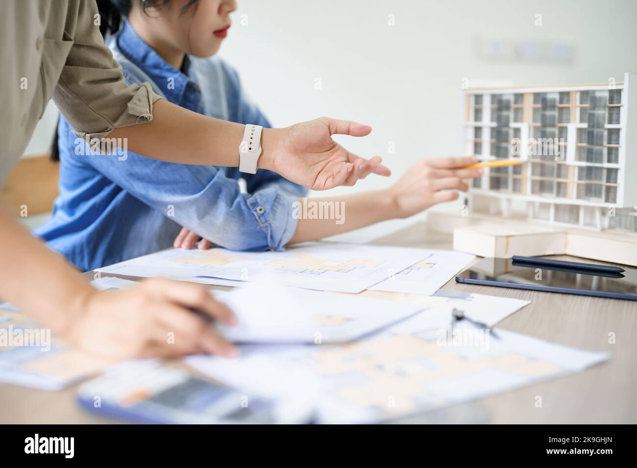 Concept of engineering consulting, Two female engineers pointing and ...