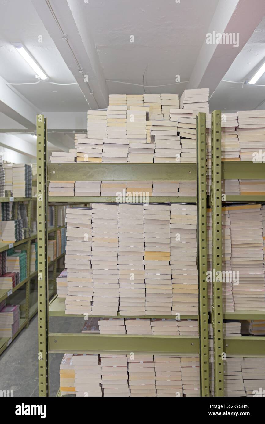 Stacks of New Books at Shelf in Storage Room Stock Photo - Alamy