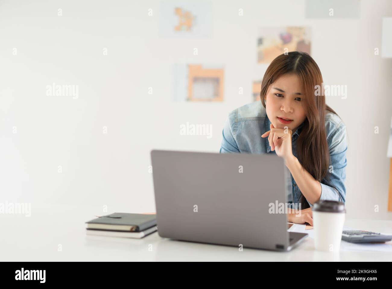 Construction design concept, Female architect use calculator and looks ...