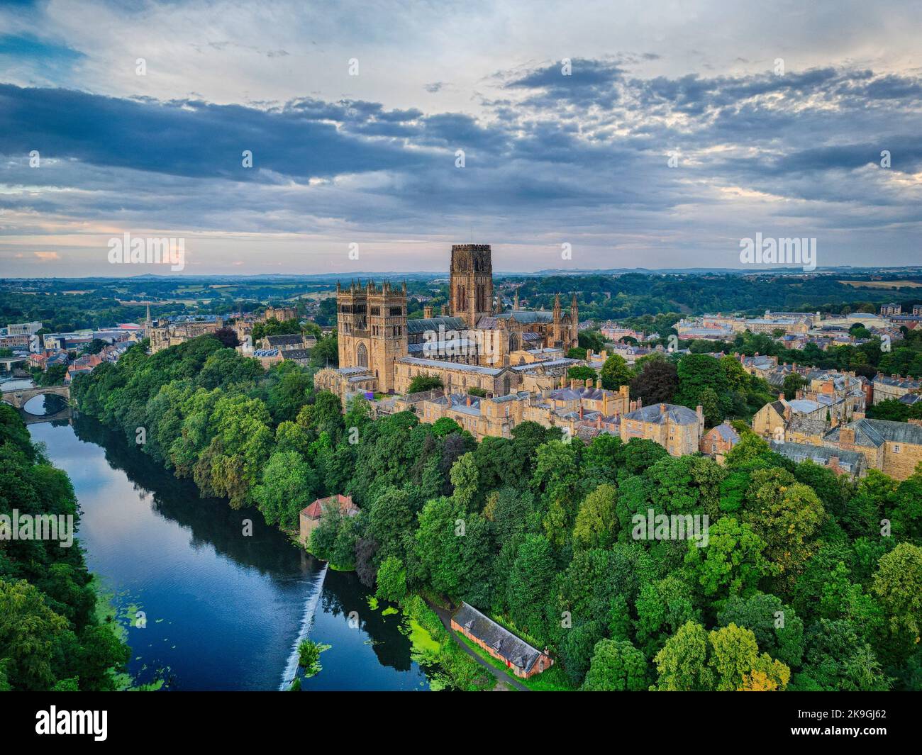 An aerial view of the Durham Cathedral, castle and river on a sunset ...