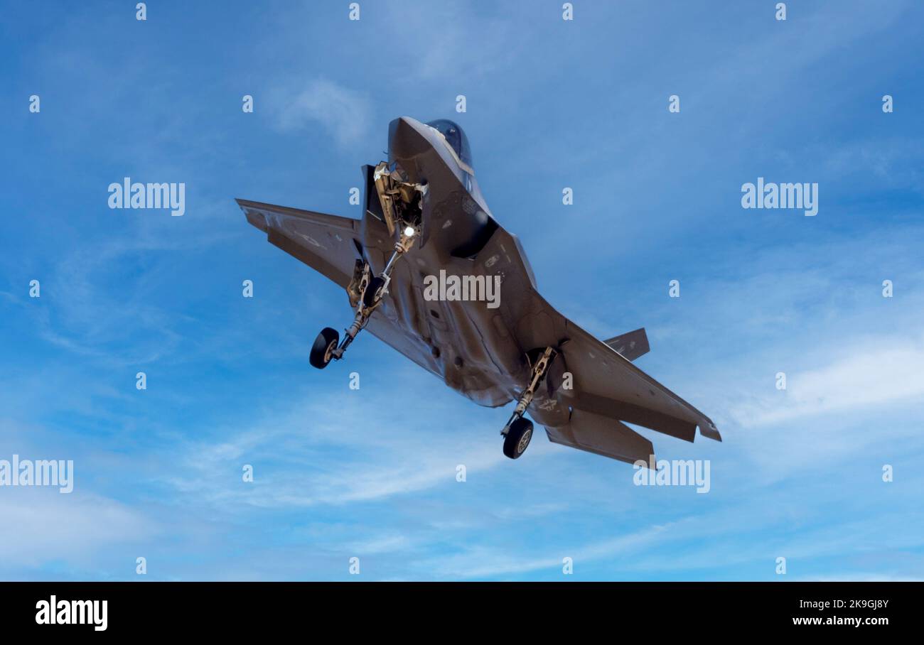 The low-angle view of fighter jet F35 flying in the blue sky Stock ...
