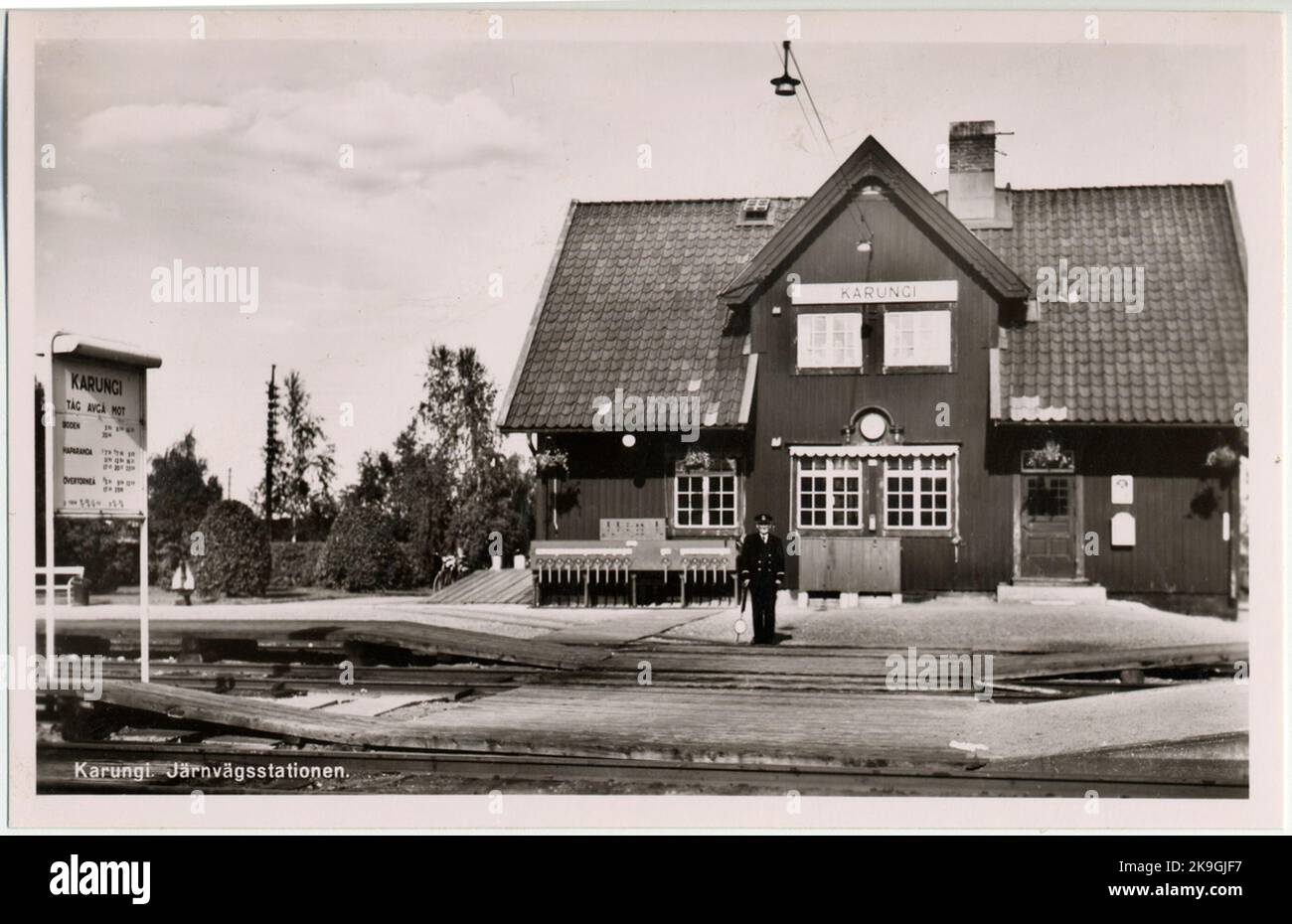 Station inspector in front of station house Stock Photo - Alamy