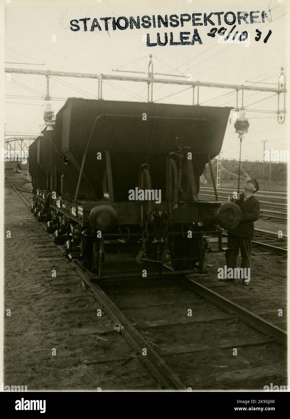 Station inspector at a ore trolley in Luleå Stock Photo - Alamy