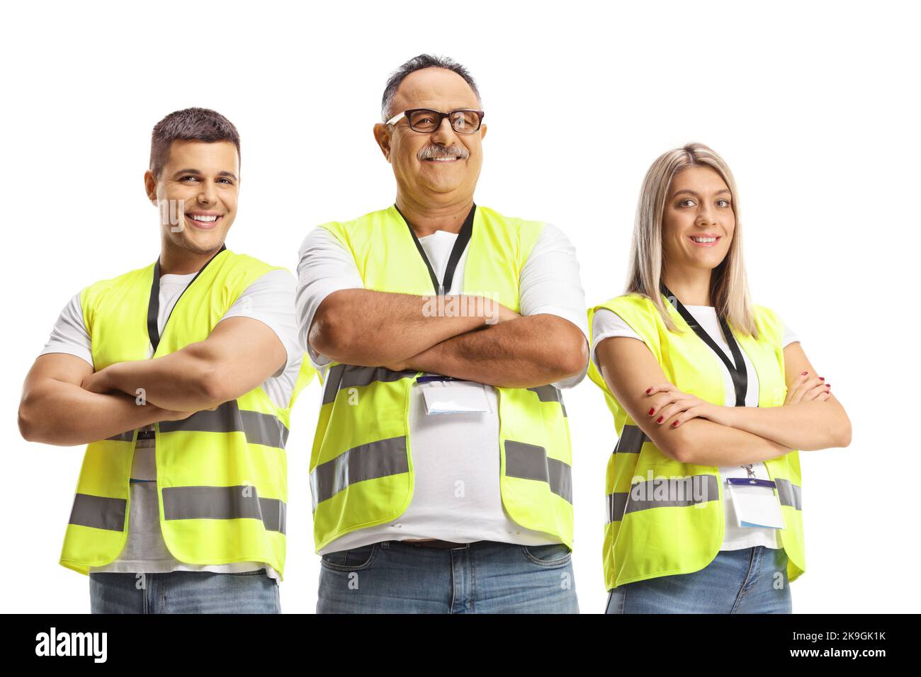 People wearing reflective safety vests and posing with crossed arms ...