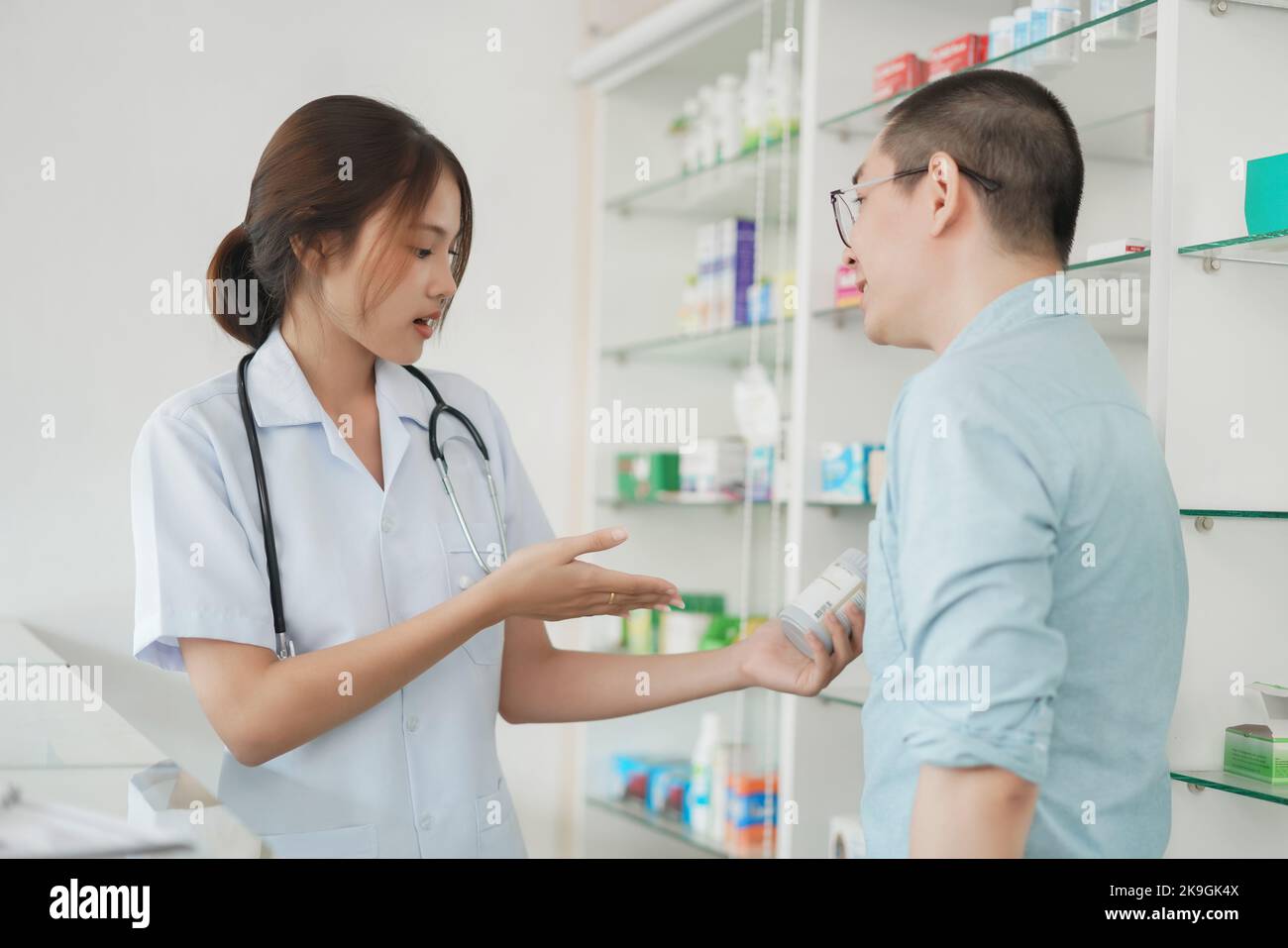 Pharmacist patient medication explain hi-res stock photography and ...