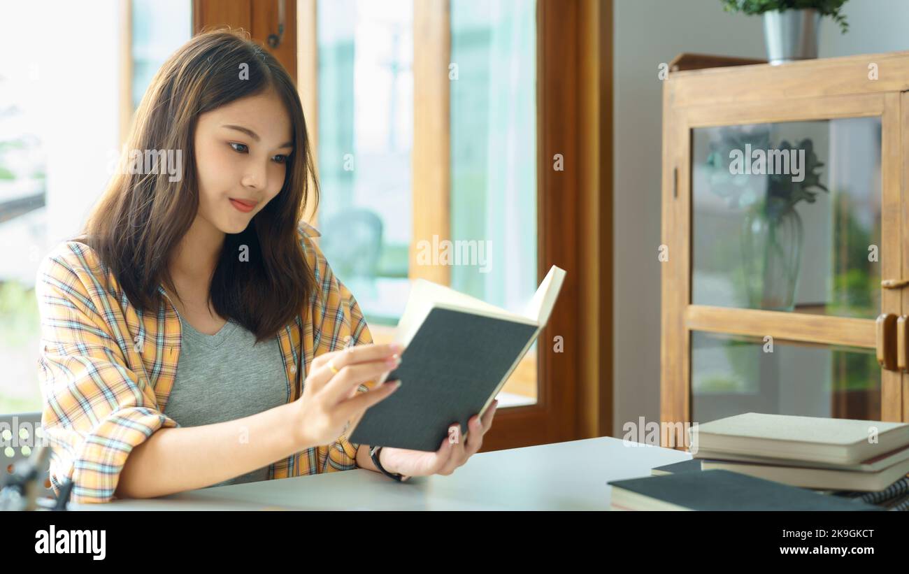 Education and literacy concept, College student girl is reading ...