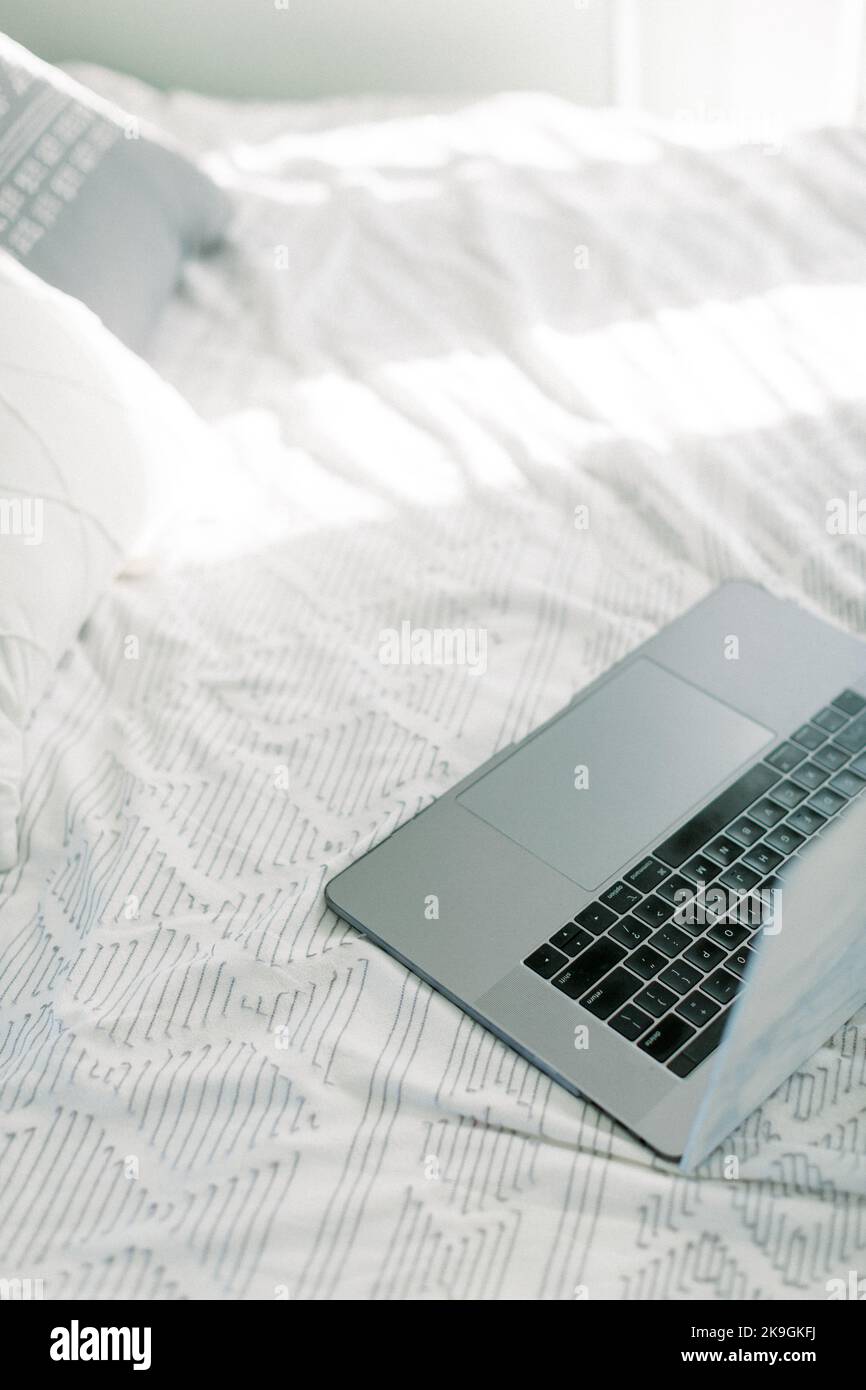 Stylish bedroom with MacBook Pro sitting in room Stock Photo - Alamy