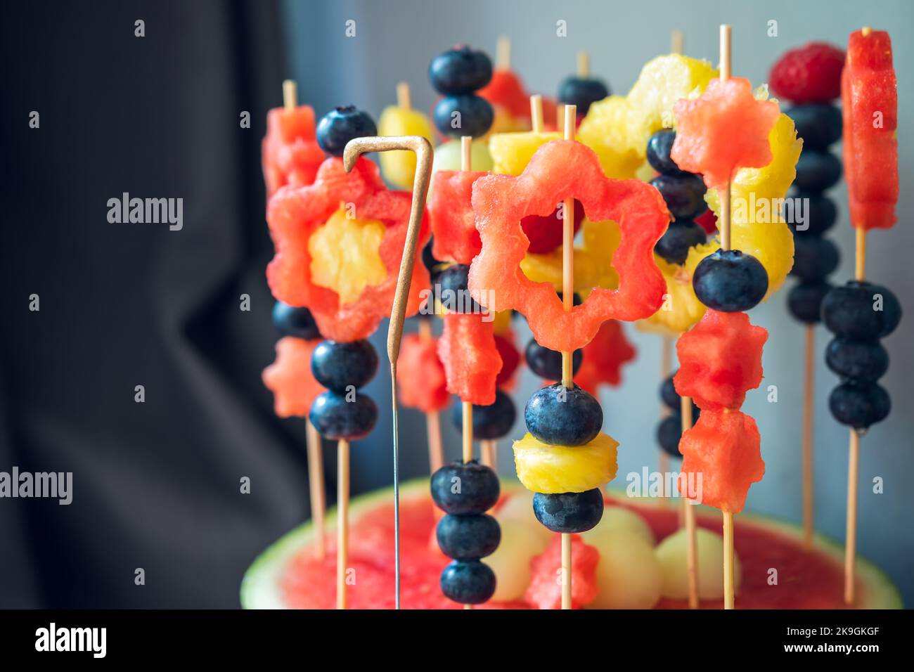 Colorful fruit dessert for a child's birthday. Various shapes of fruit ...
