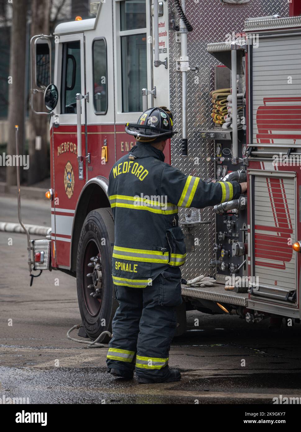 A firefighter at an industrial fire Stock Photo - Alamy