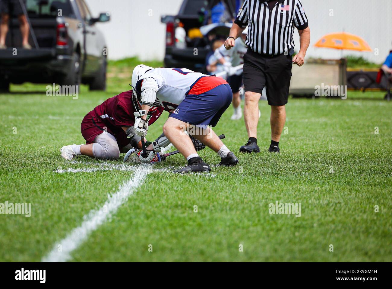 A sports field with two players competing in lacrosse match Stock Photo ...