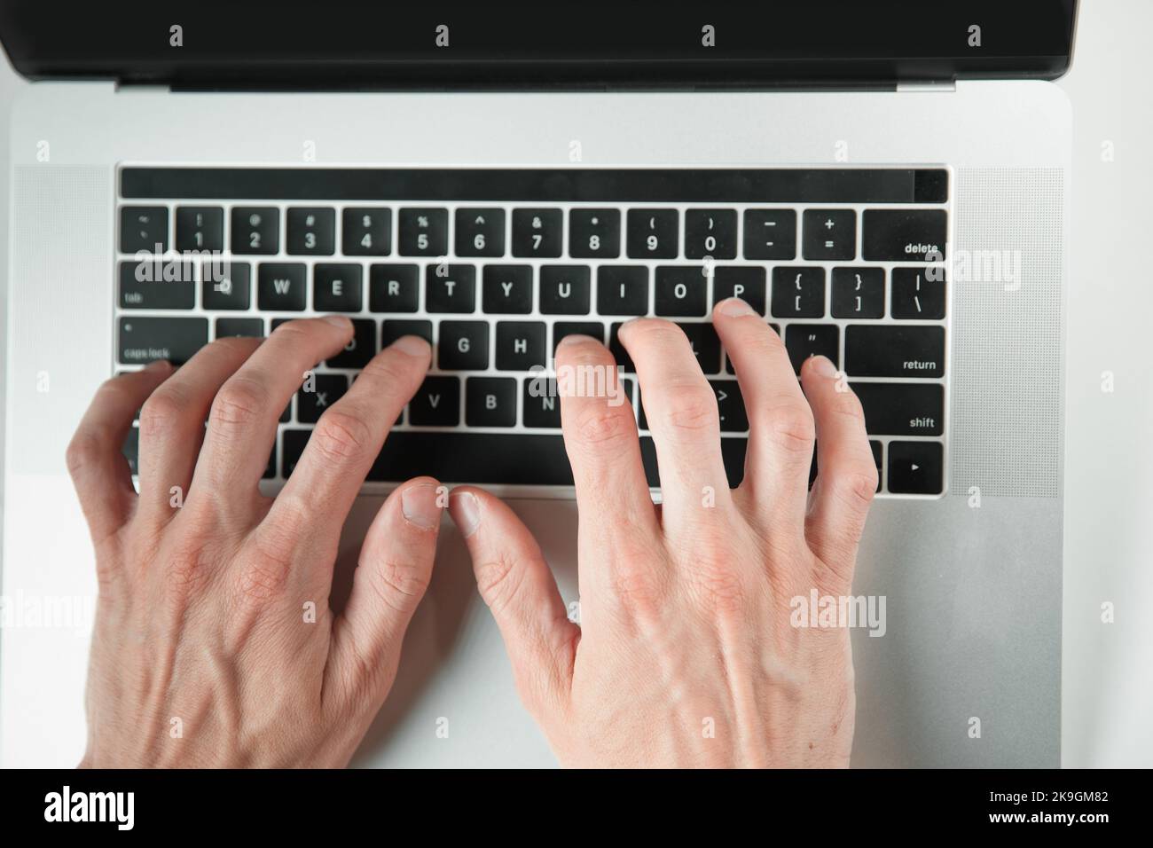 top view. man typing on a laptop keyboard. people and technology Stock ...