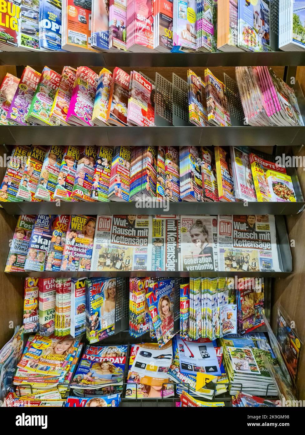 A large display of German illustrated magazines in a market for sales ...