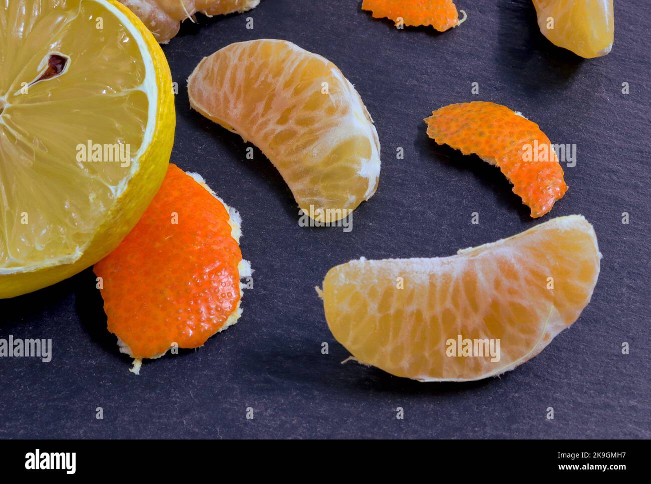 citrus mandarin lemon with mandarin peel on black background Stock ...