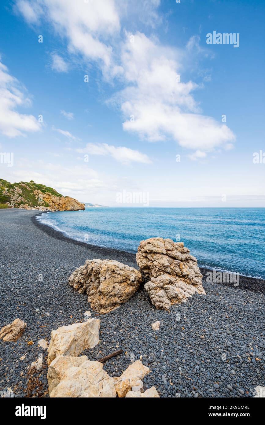 A vertical shot of Mavra Volia beach on the Greek island of Chios in ...