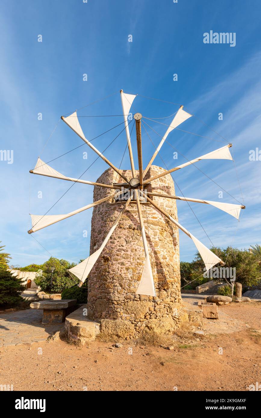 A traditional Stone windmill against a blue sky in Lasithi, Crete ...