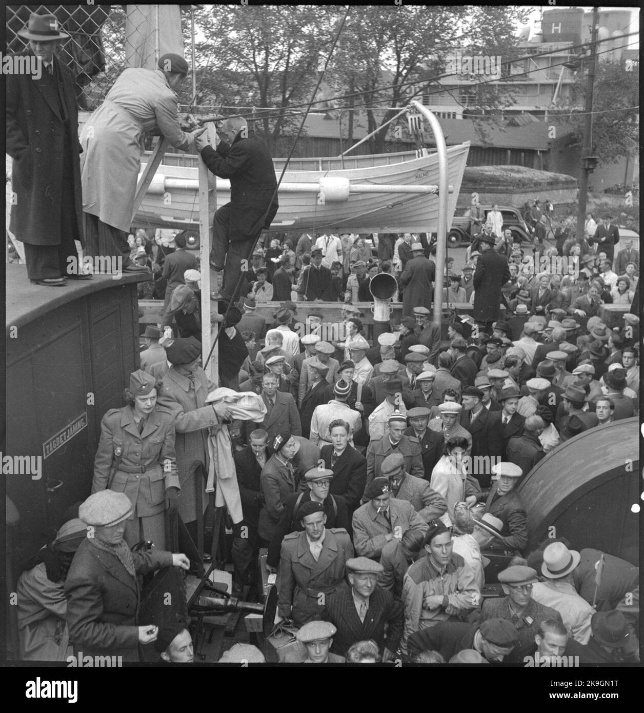 Danish refugees on their way home, aboard the train ferry Malmö. Here ...