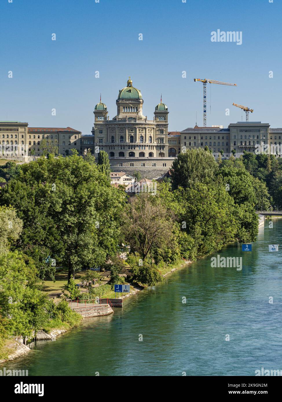 A vertical shot of the river Aare and the buildings in Bern ...
