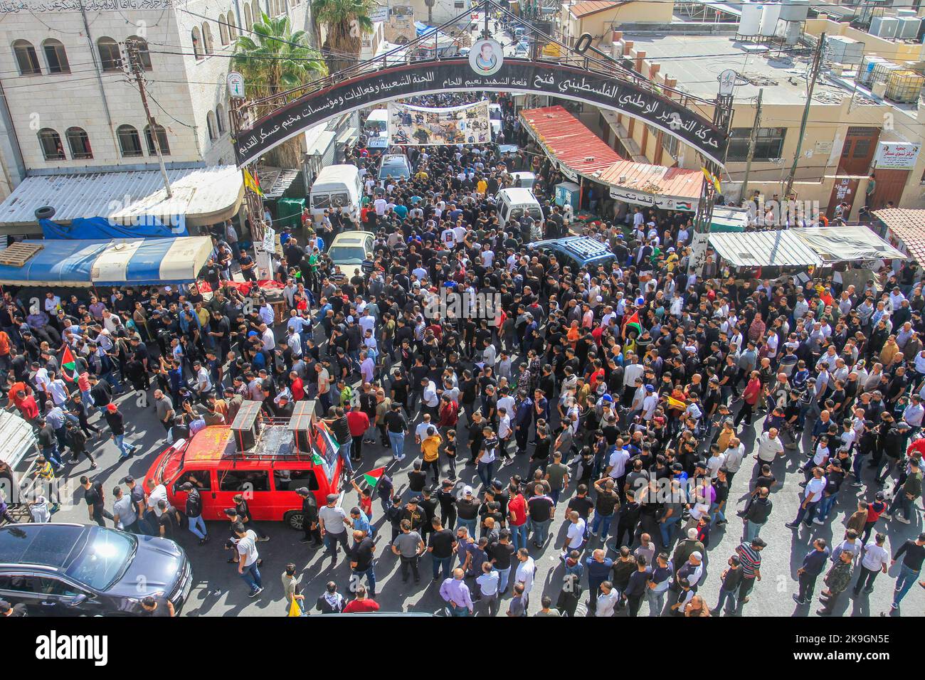 Nablus, Palestine. 28th Oct, 2022. Mourners carry the bodies of two Palestinians Imad Abu Rashid ...