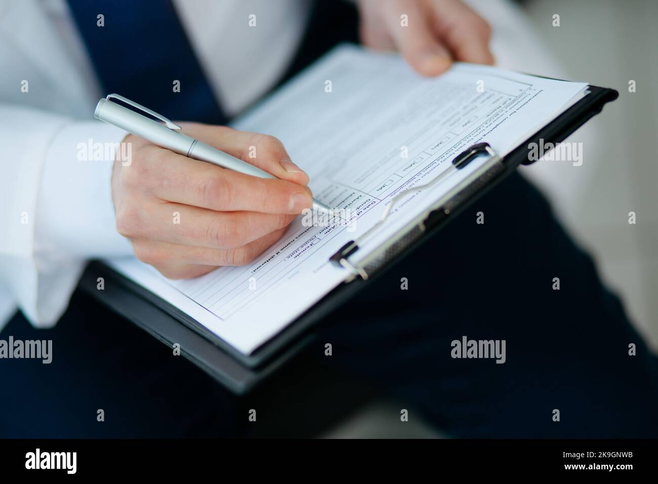 close-up. doctor making notes on the clipboard . health care concept ...