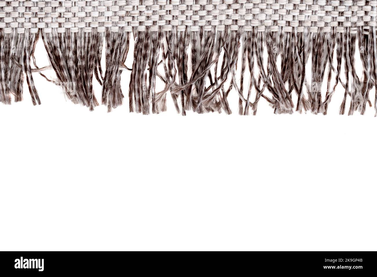 Fringe on a light gray fabric with an empty space for an inscription ...