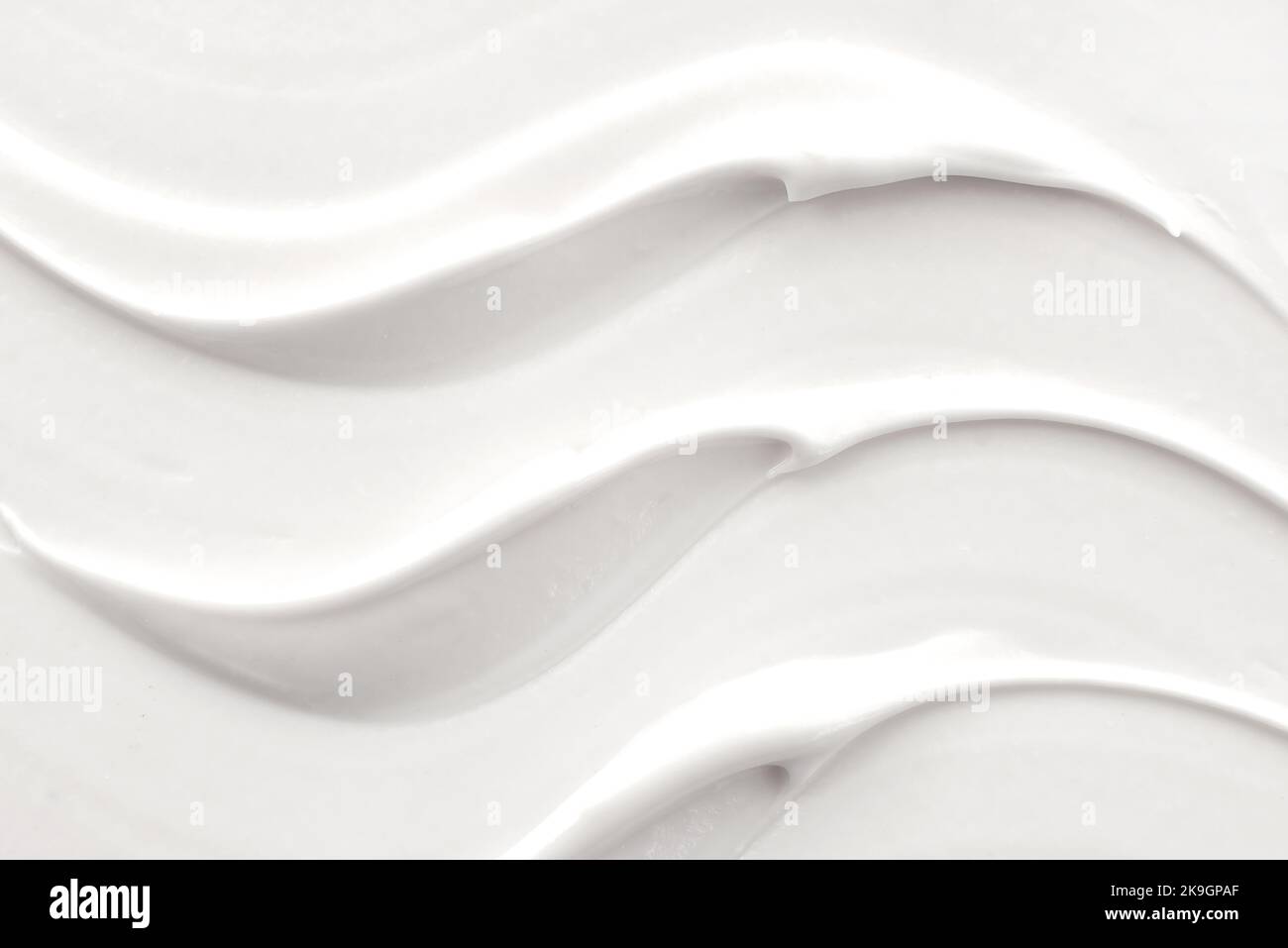 Texture of white face cream is smeared. Cosmetic products for makeup ...