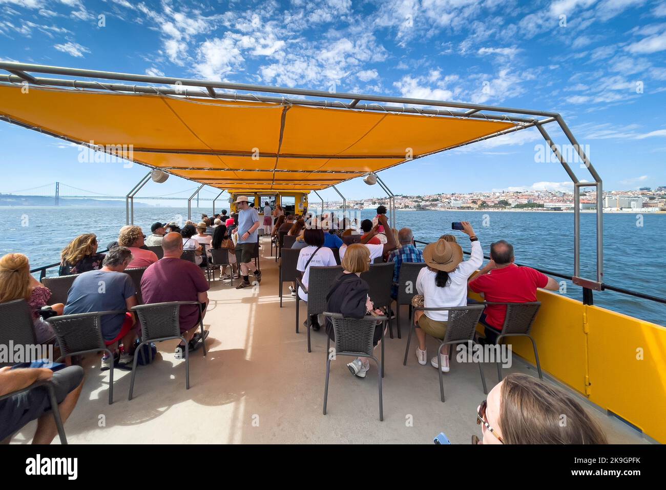 Group of tourists taking a ride on a tour boat Stock Photo - Alamy