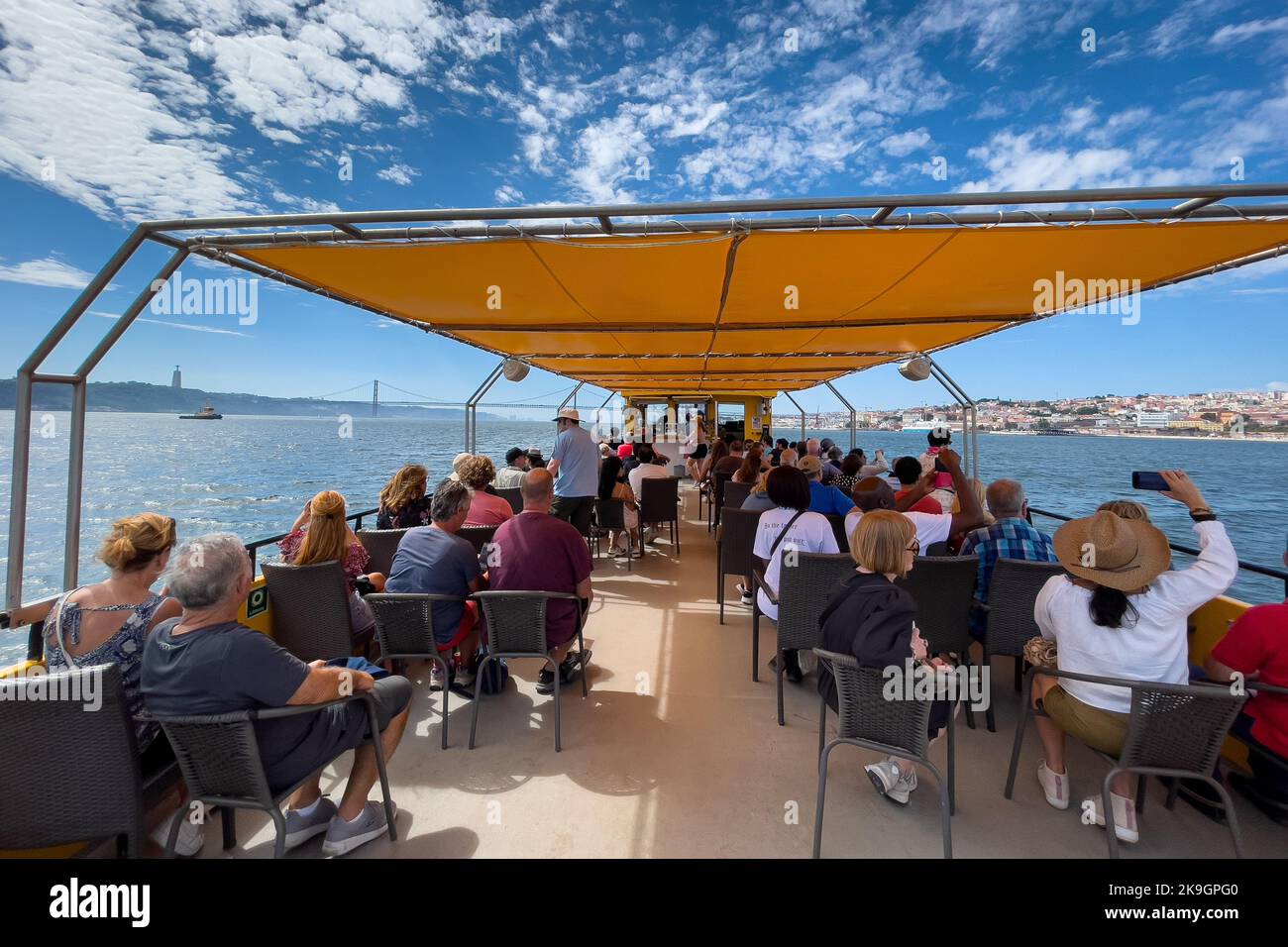 Group of tourists taking a ride on a tour boat Stock Photo - Alamy